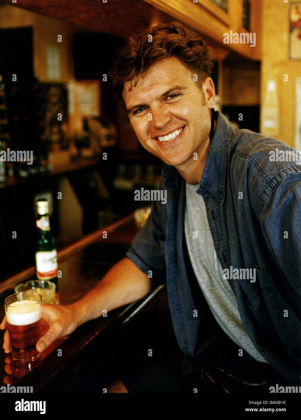 Sam Miller actor stars in THE BILL drinking Stock Photo - Alamy