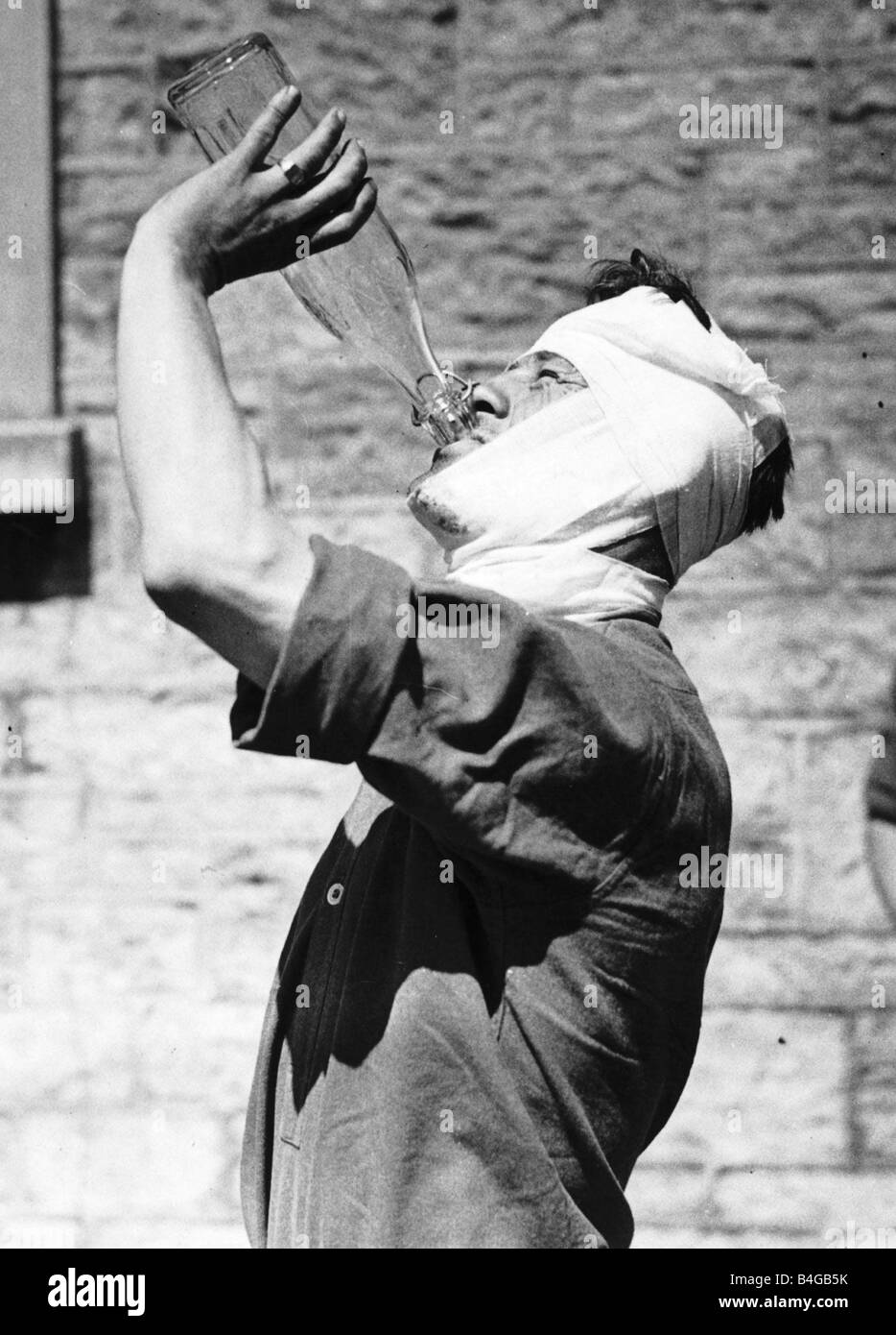 This soldier shows his unbreakable spirit by having a drink even when ...