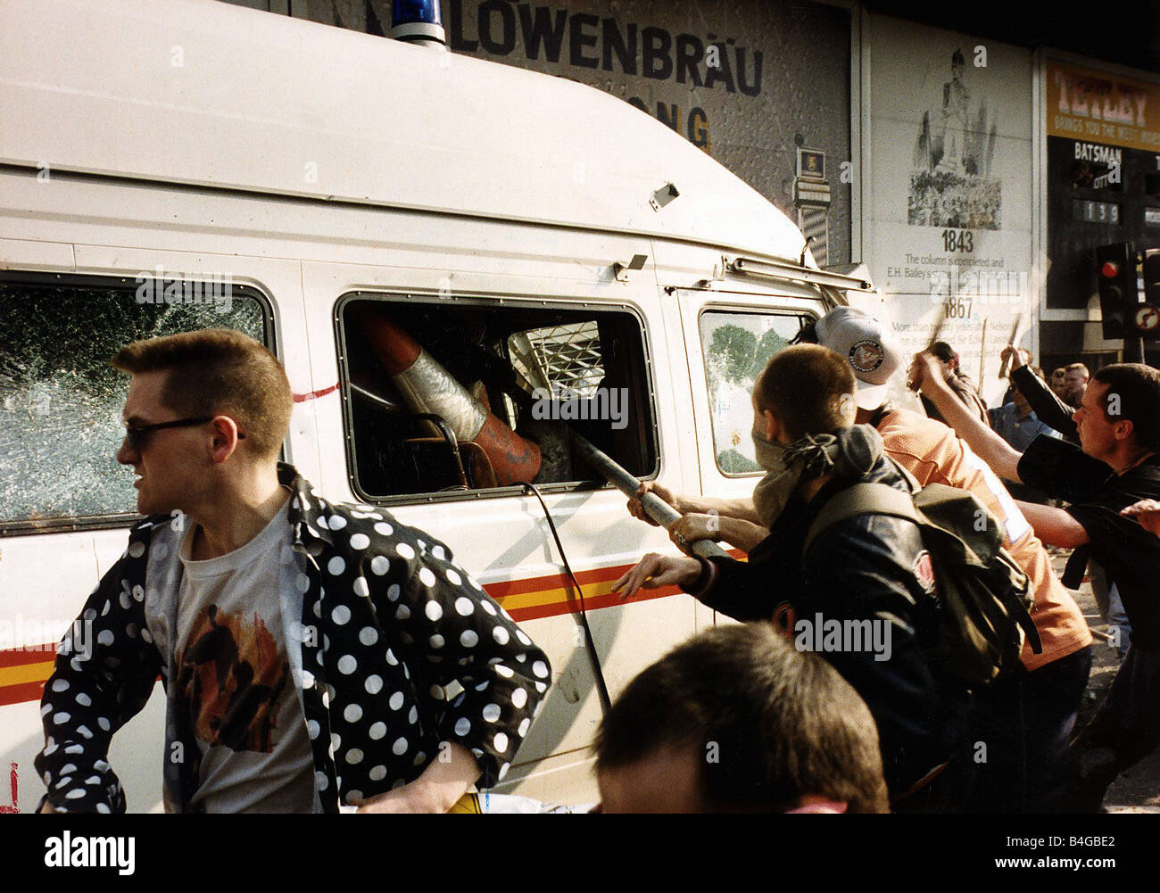 Demonstrators attack a police van during the Poll Tax riot in Trafalgar ...