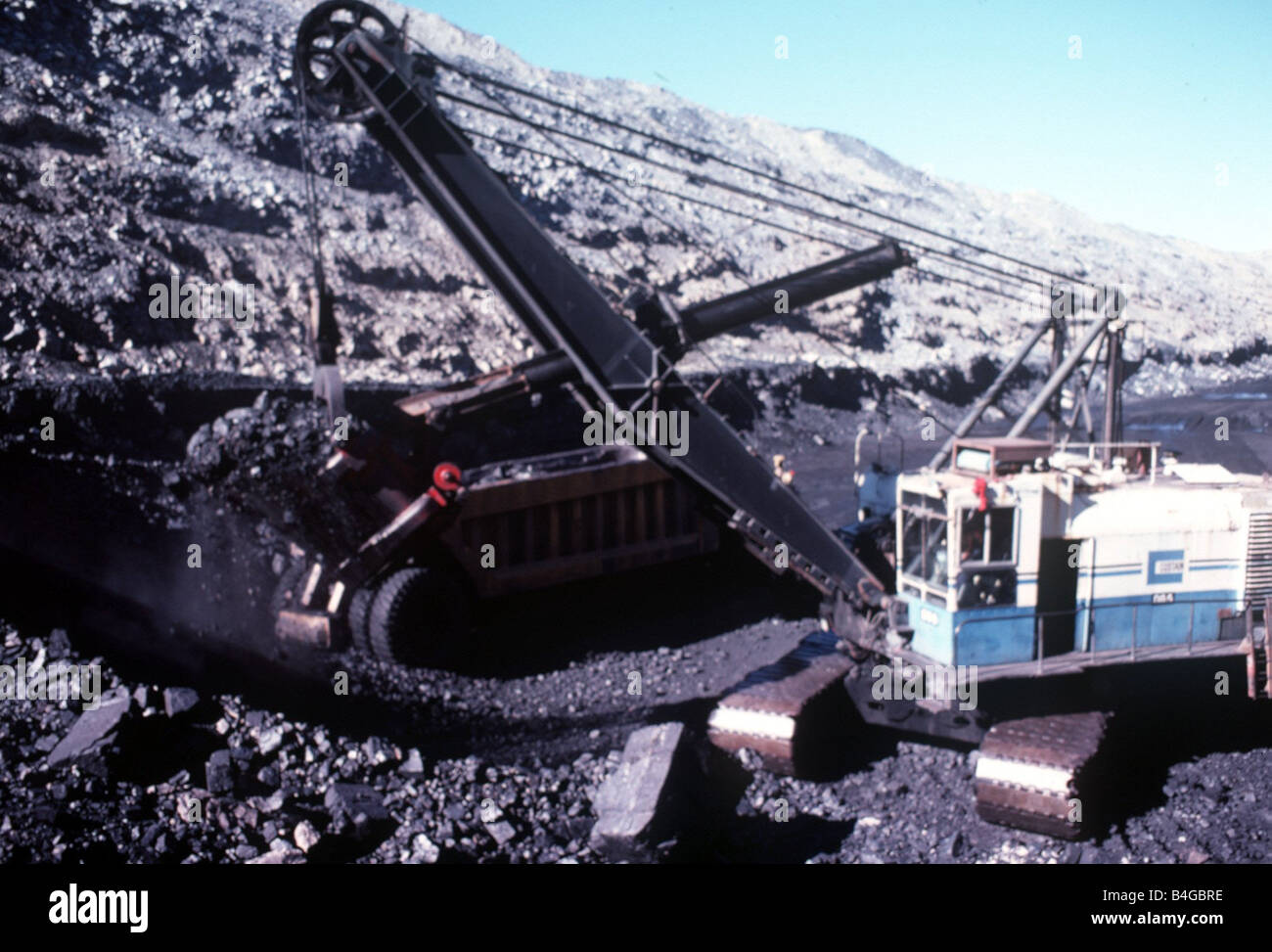 Nine centimetre bucket filling 110 tonne haul unit with black coal at ...