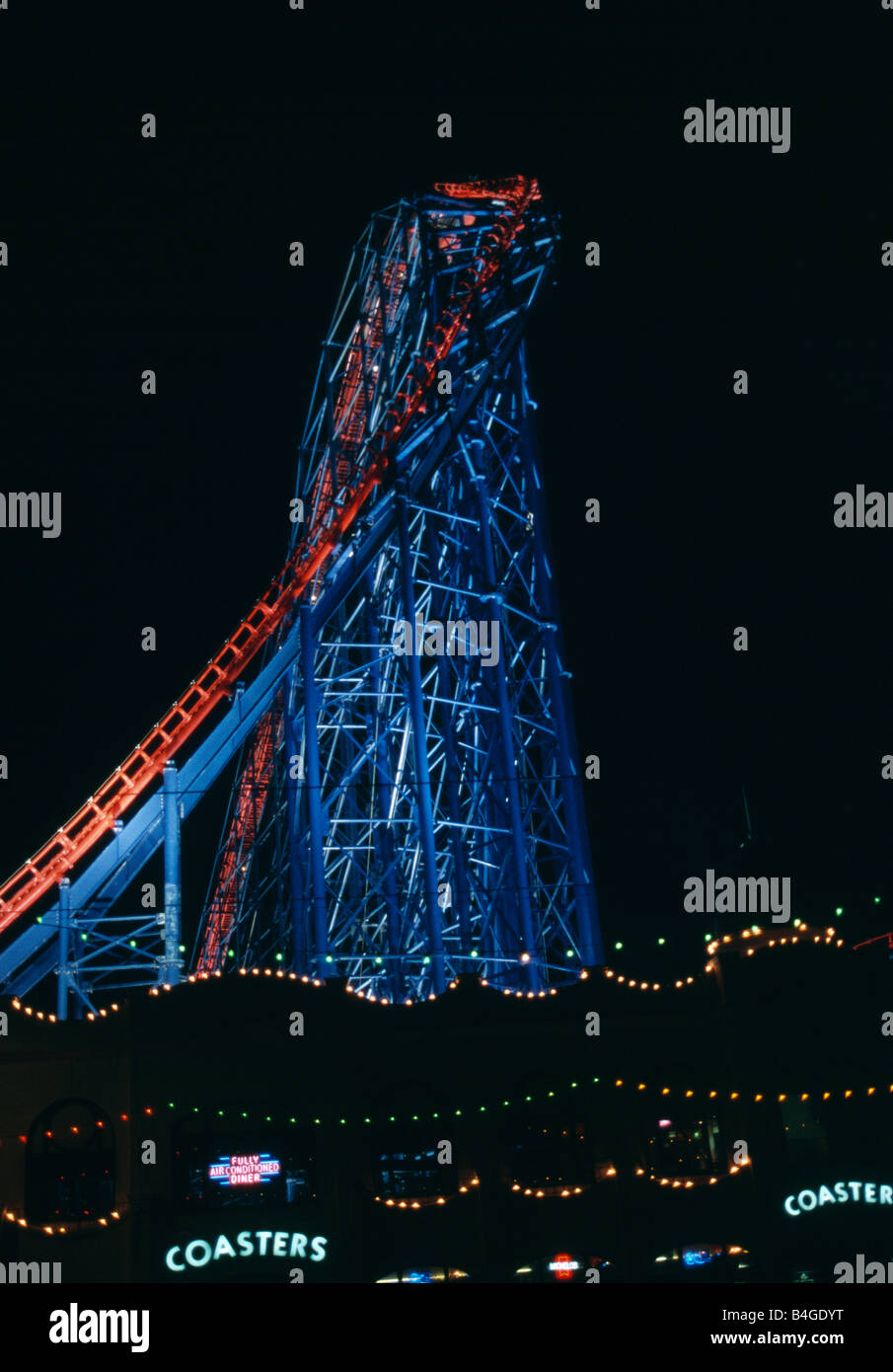 Tall blue rollercoaster lit at night at Blackpool Pleasure Beach in ...
