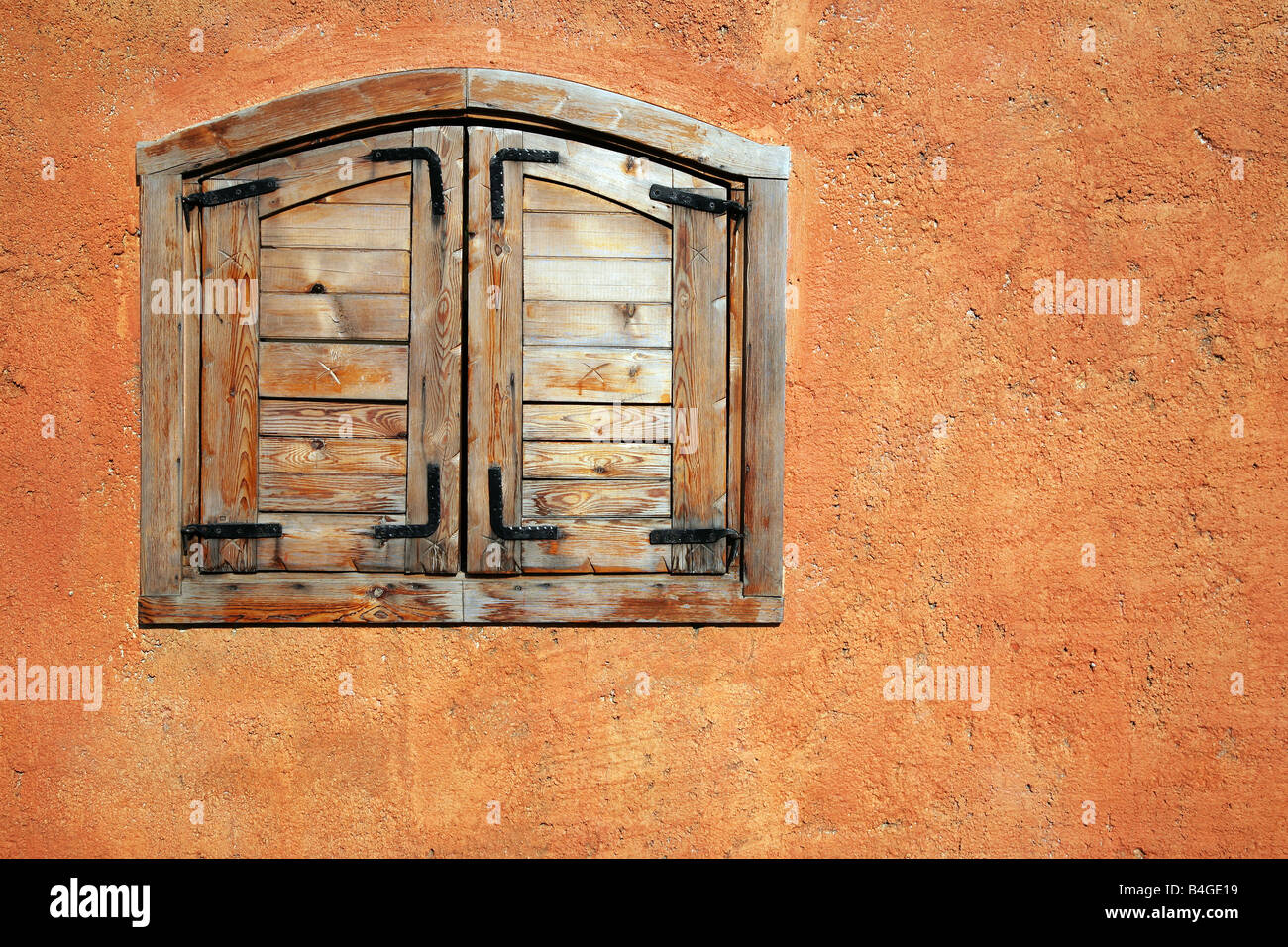 Window closed by wooden shutters Stock Photo - Alamy