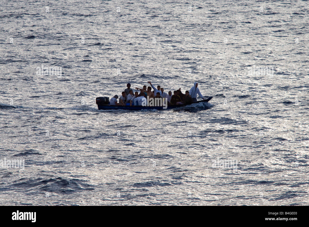 Italian navy rescue refugee boat people Stock Photo - Alamy