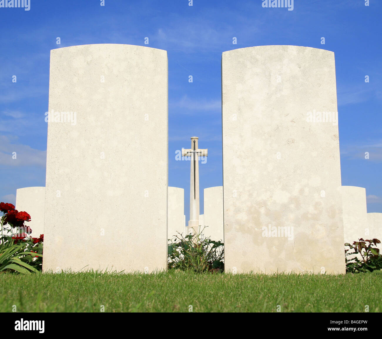 View between two headstones at the Cross of Sacrifice in the British ...