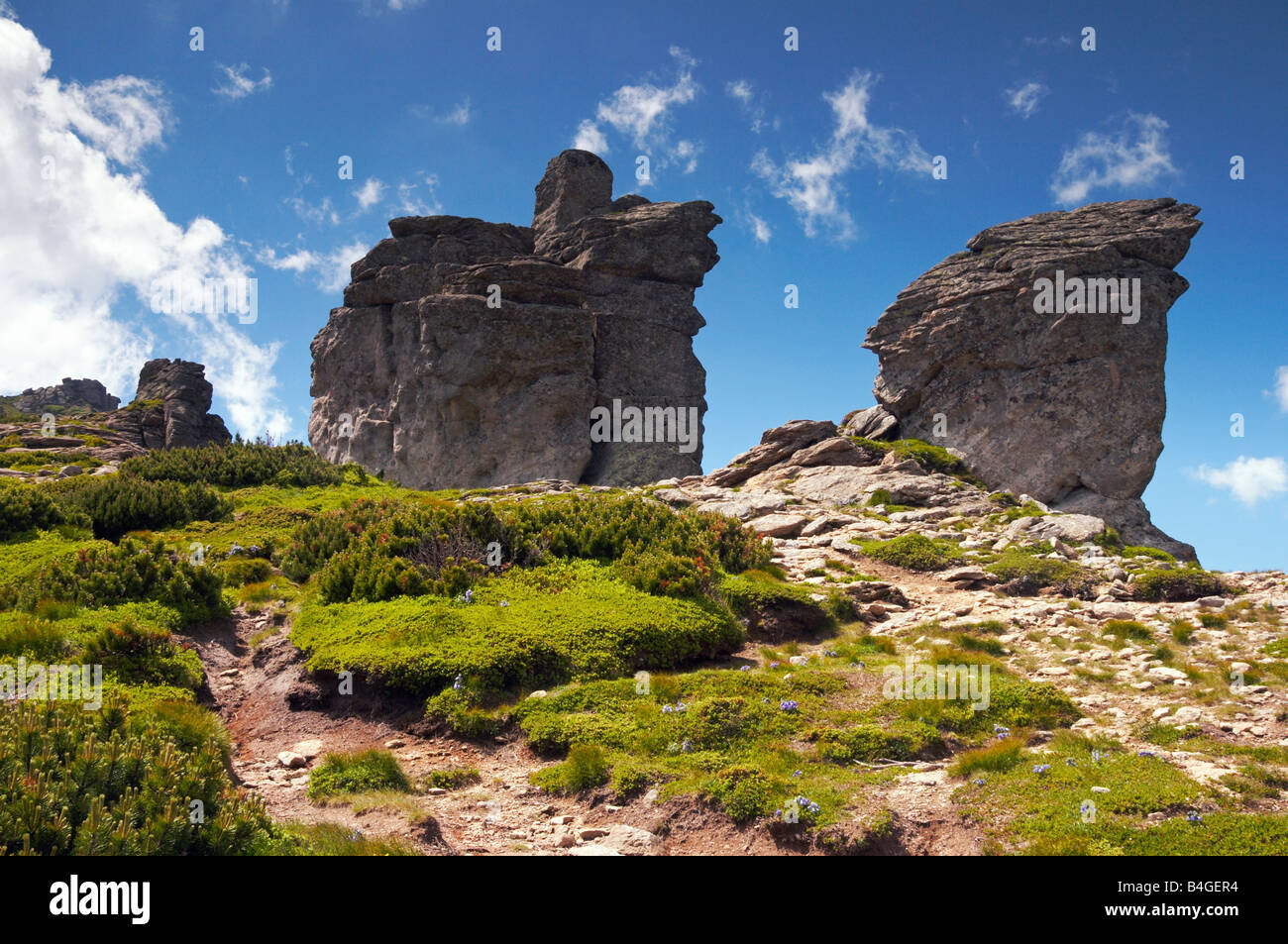 Big stony figure on mountain ridge Stock Photo - Alamy
