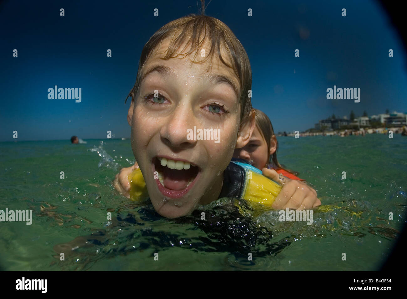 kids swimming at the beach Stock Photo - Alamy