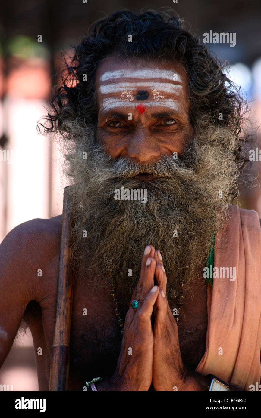 A hindu priest greeting people Stock Photo - Alamy