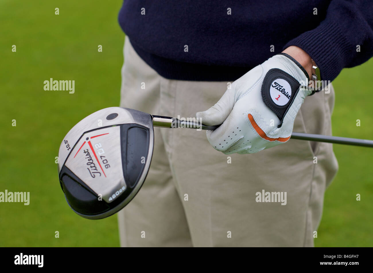 Professional golfer with a driver in his hand Stock Photo - Alamy