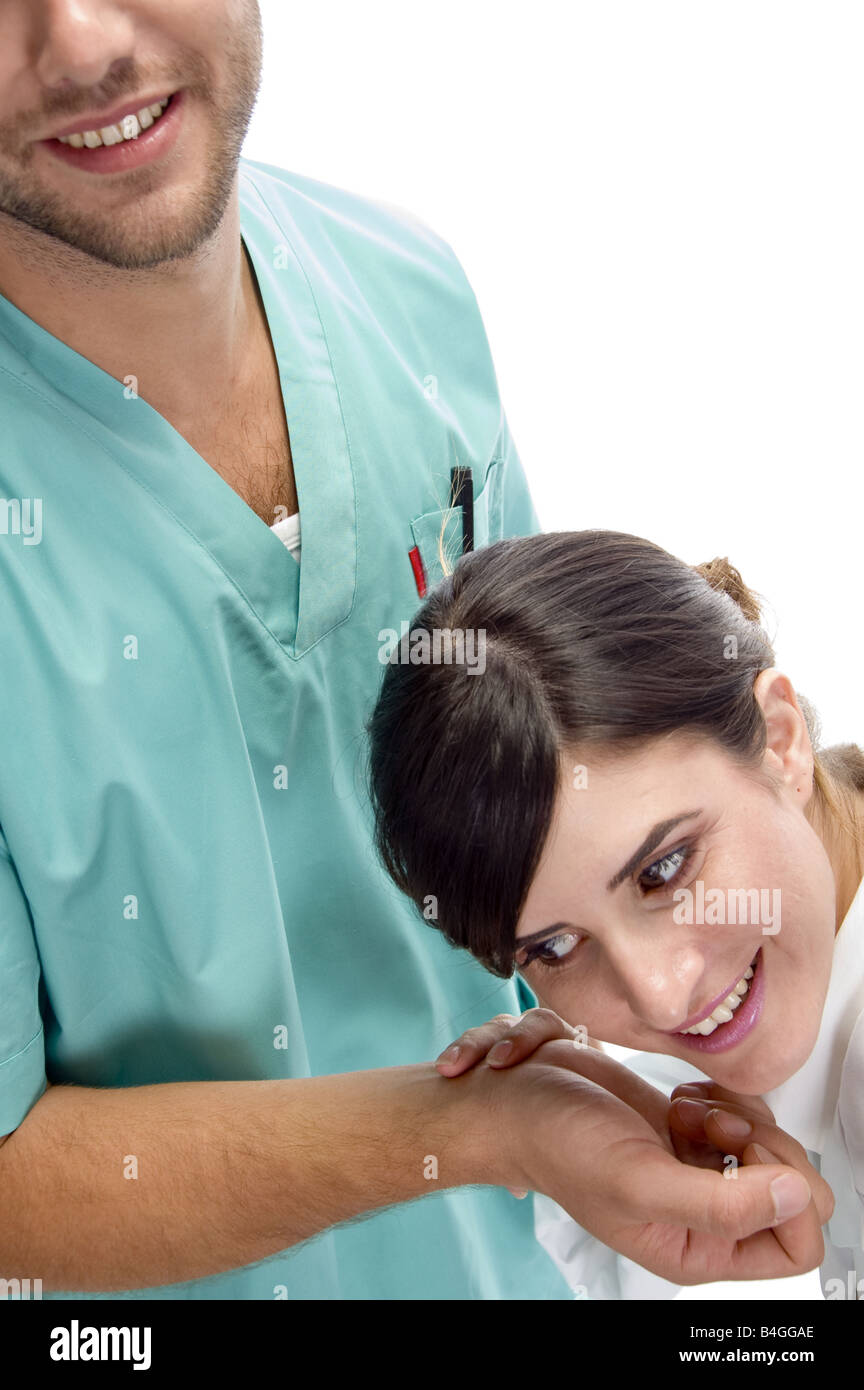 smiling nurse checking pulse of patient Stock Photo - Alamy