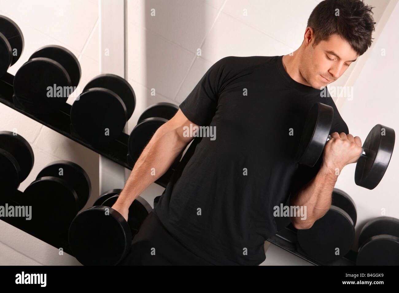 Man Lifting Weights In Gym Stock Photo - Alamy