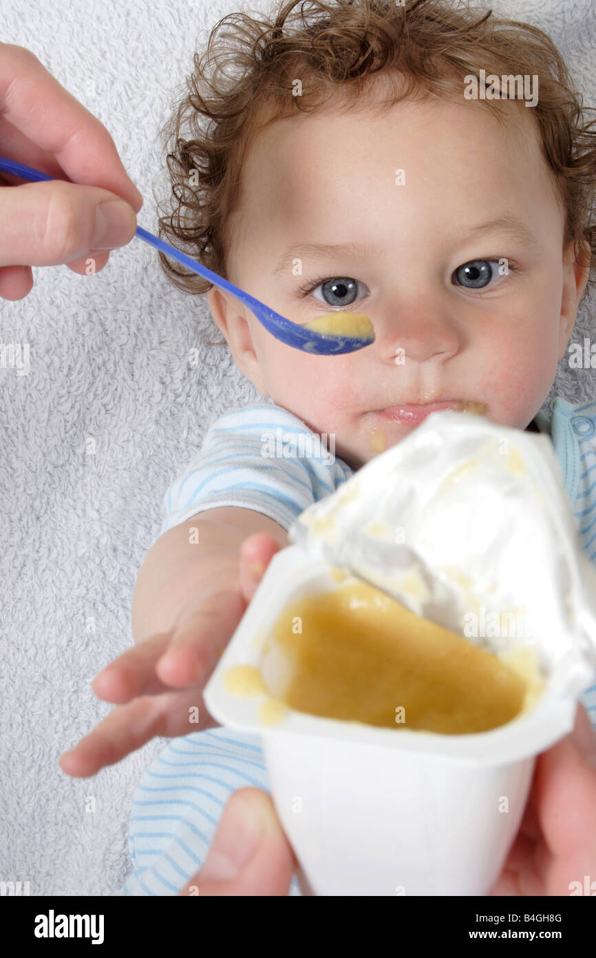 little baby being spoonfed Stock Photo - Alamy