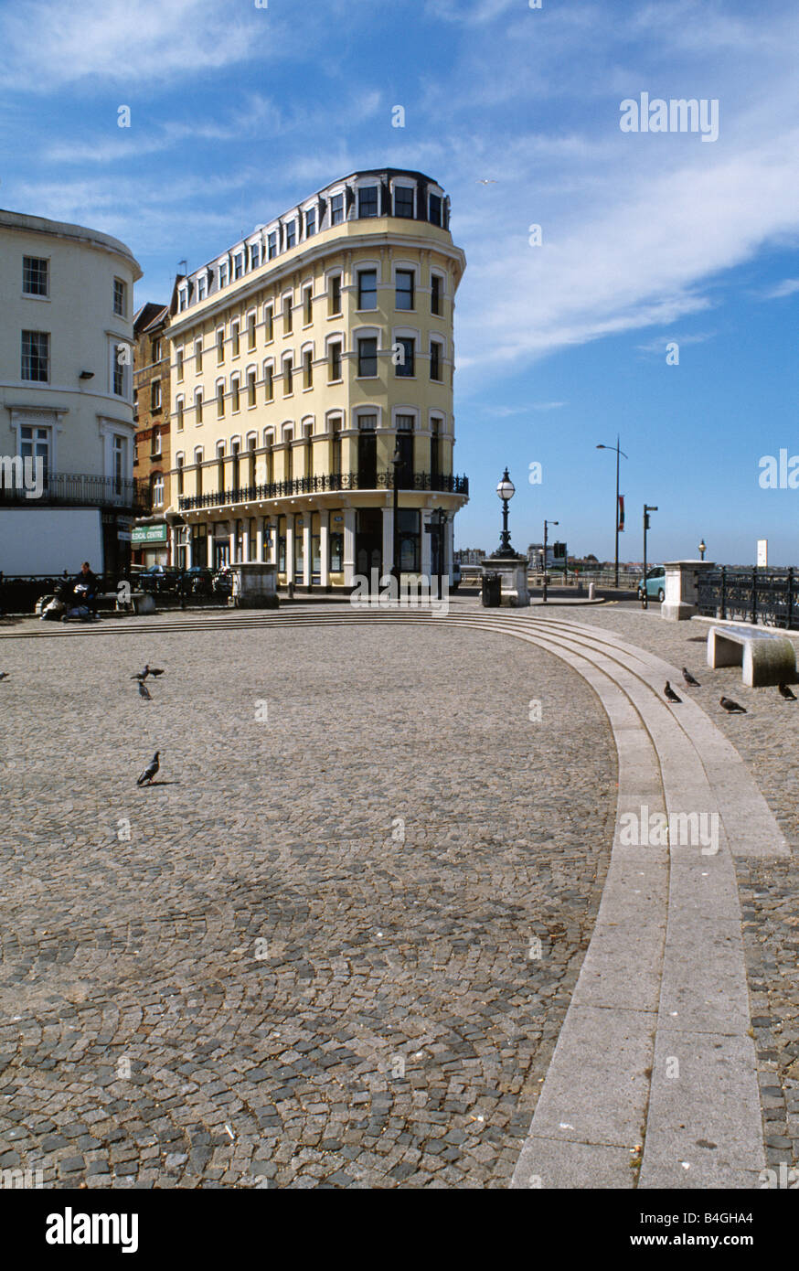 Paved promenade in front of narrow Victorian department store at ...