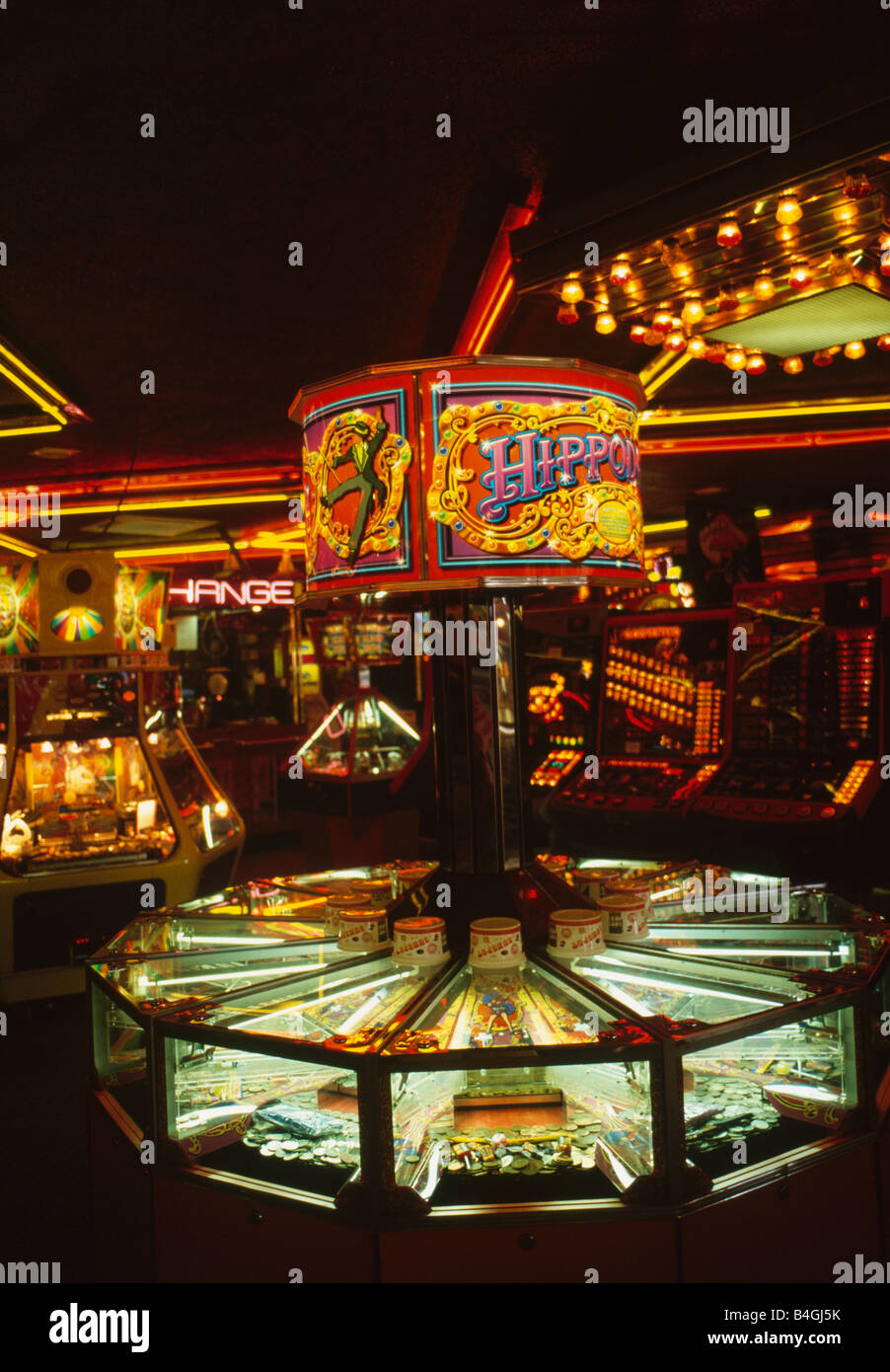 Illuminated rides in fairground at night Stock Photo - Alamy