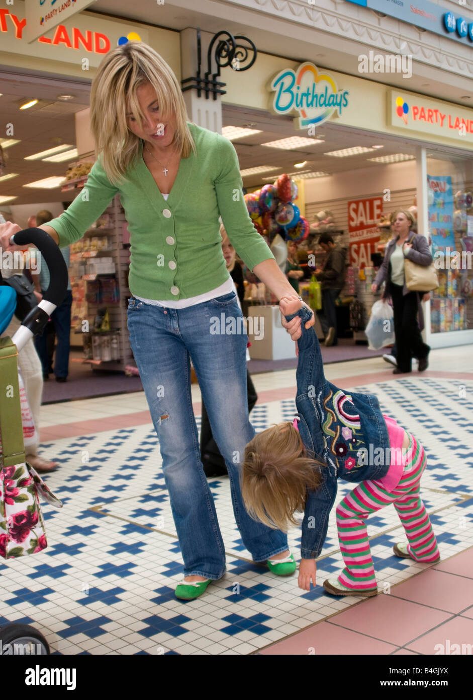 little girl having a tantrum in a shopping centre Stock Photo - Alamy