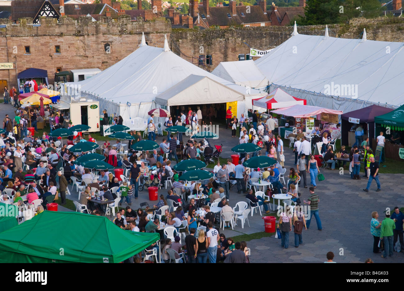People sit eating and drinking at Ludlow Food Festival Ludlow ...