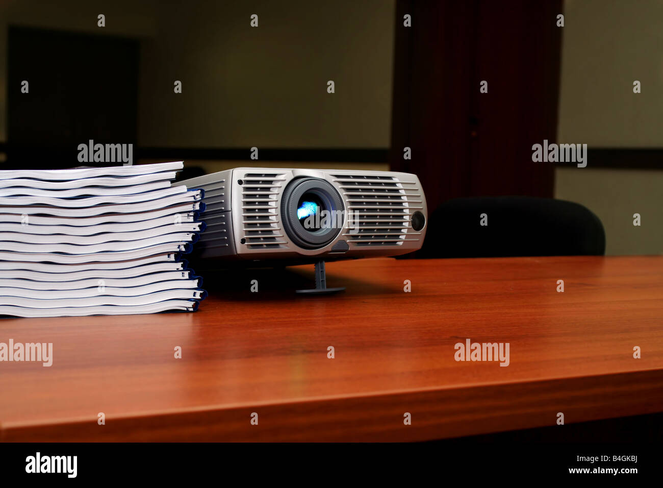 Projector with pile of books Stock Photo - Alamy