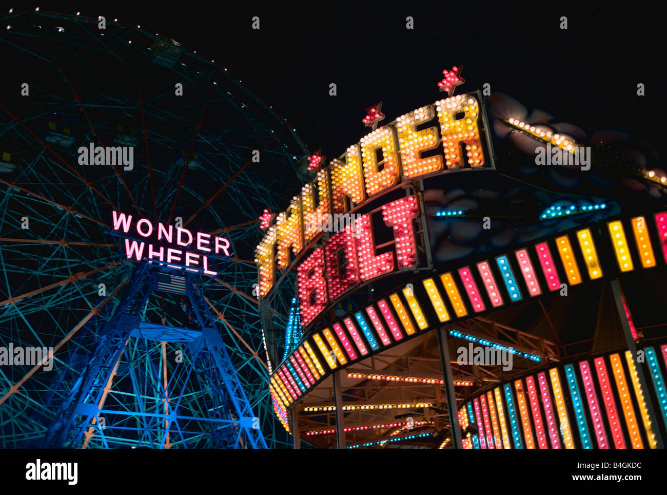 Thunder Bolt ride and Wonder Wheel at night Coney Island New York Stock ...