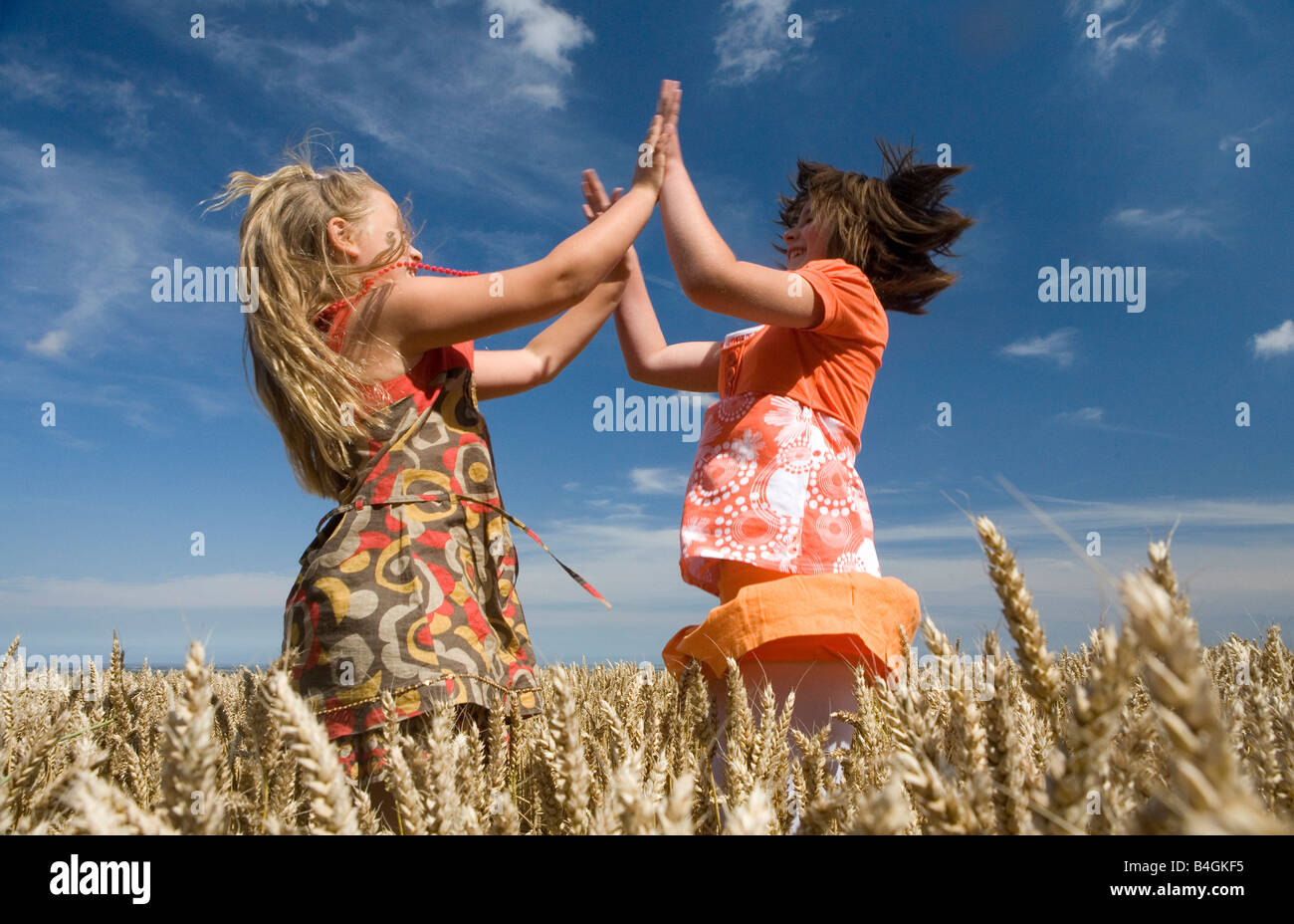 Children playing in field Stock Photo - Alamy