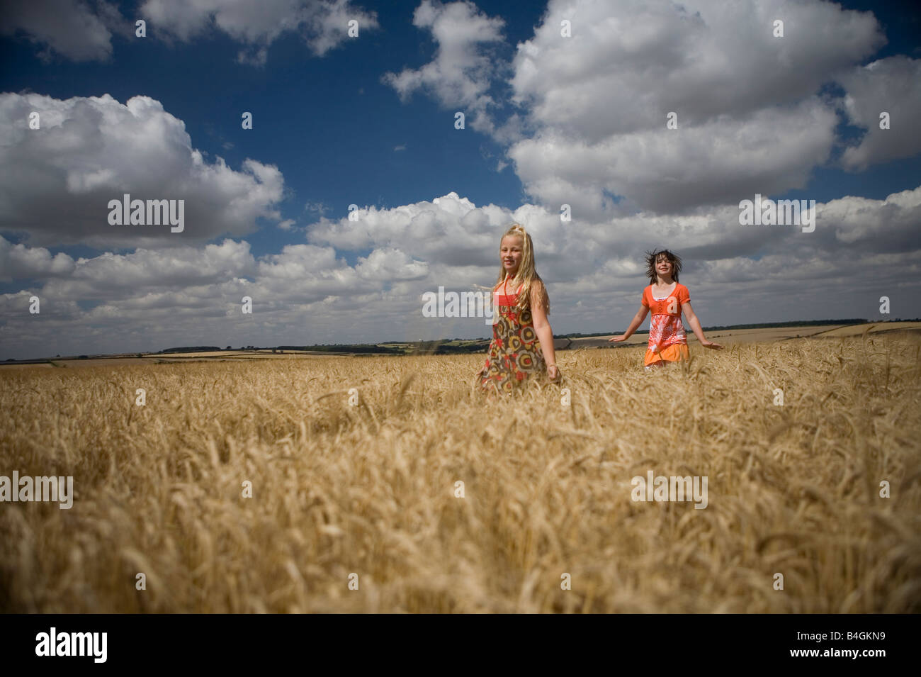 Children playing in field Stock Photo - Alamy