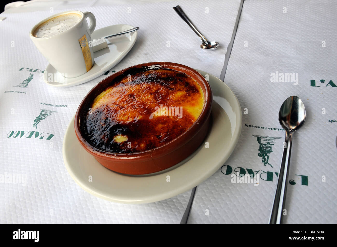 A Catalan flan dessert baked eggs and cream served in a terracotta dish ...