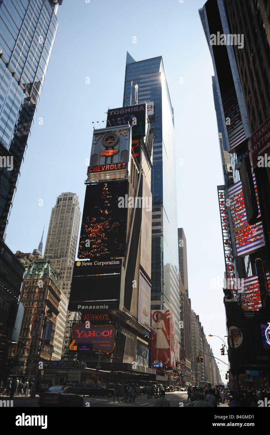 Fairly classic shot of times square with clear blue sky providing ...