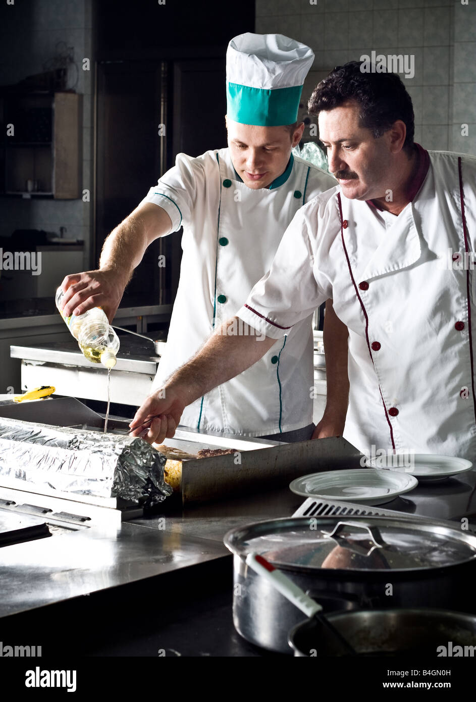 Two chefs at work Stock Photo - Alamy