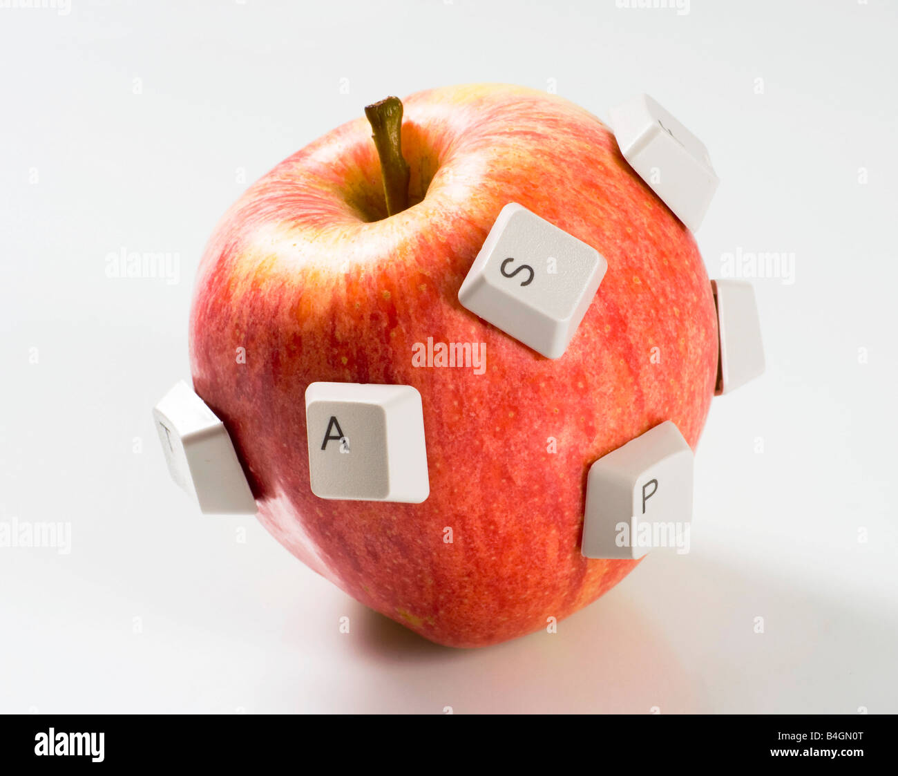 Computer keys on a red apple Stock Photo - Alamy