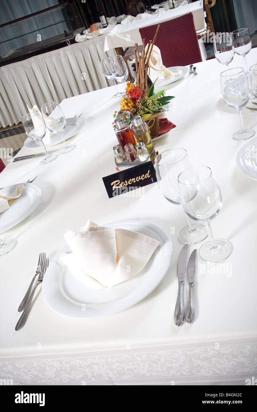 Reserved dining table in restaurant Stock Photo - Alamy