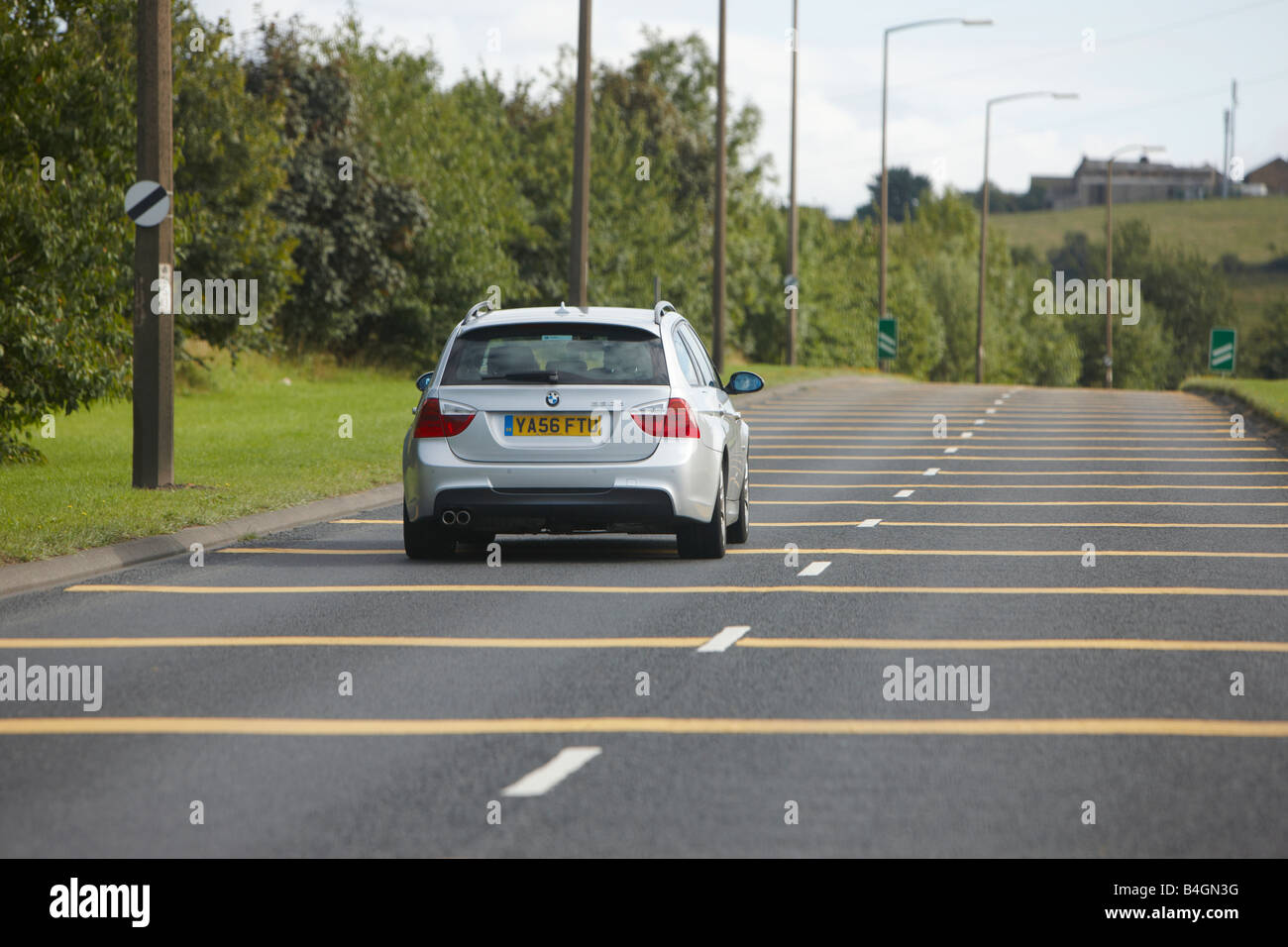 Silver BMW estate car driving Stock Photo - Alamy