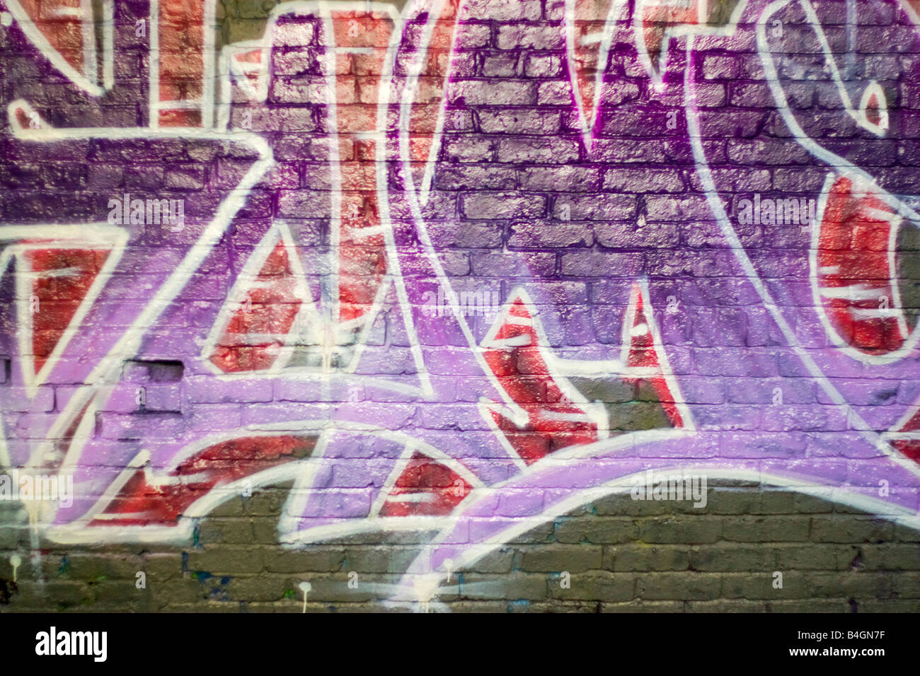 An old brick wall that is covered with graffiti This makes an excellent ...