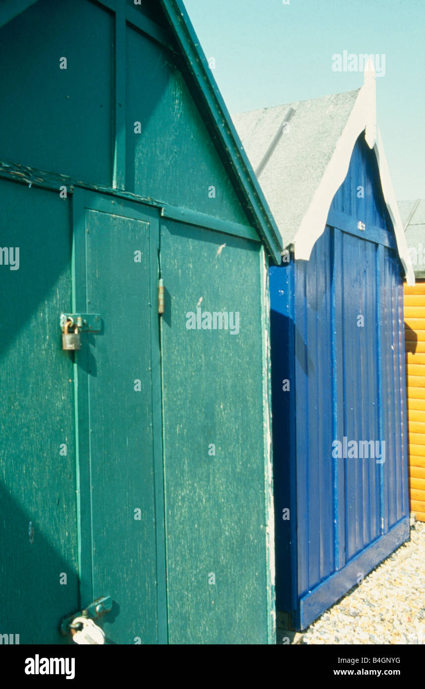 Green and blue painted wooden beach huts at Herne Bay in Kent Stock ...