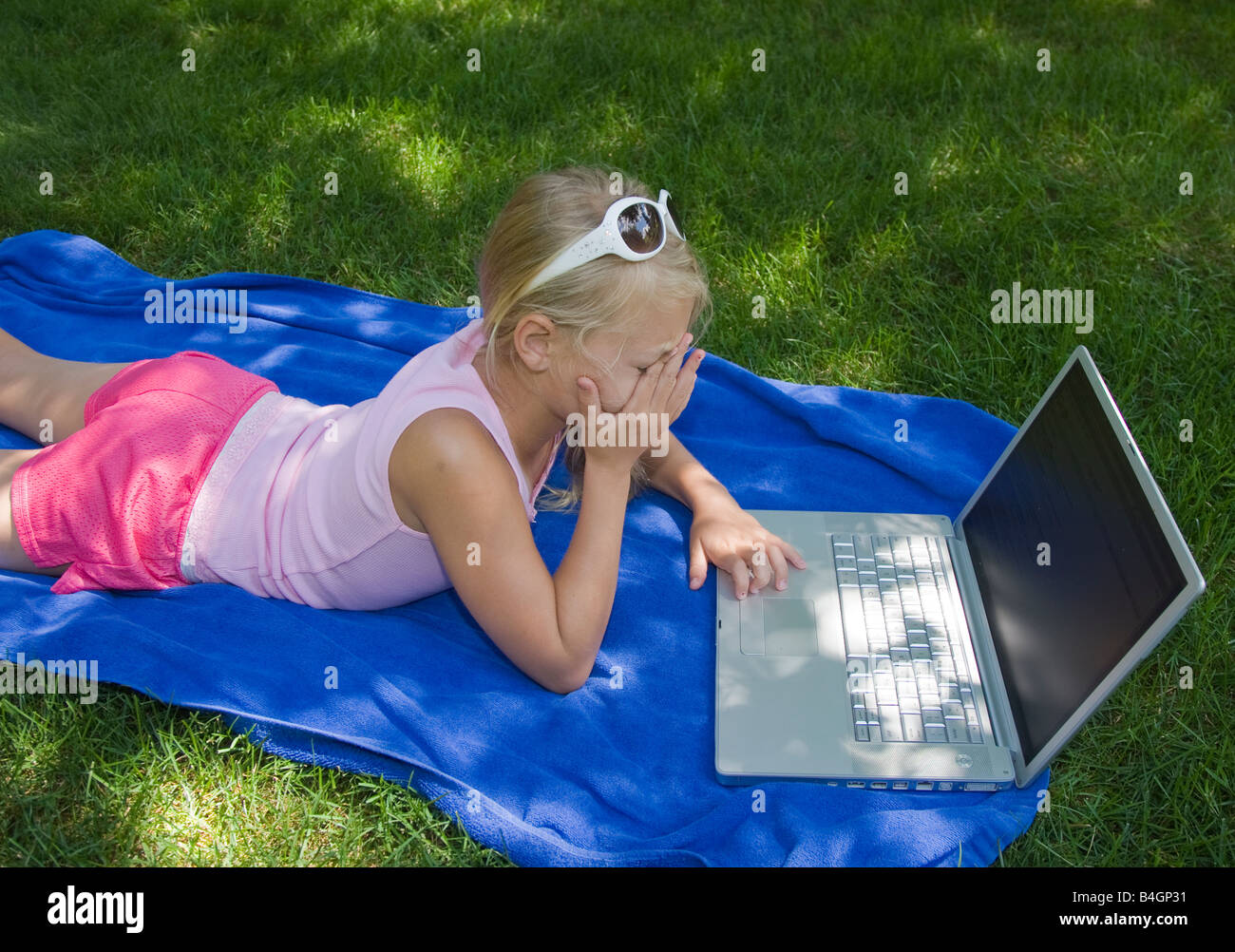 Young girl working on a laptop Stock Photo - Alamy