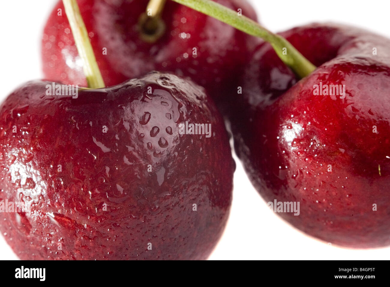 three red cherries Stock Photo - Alamy