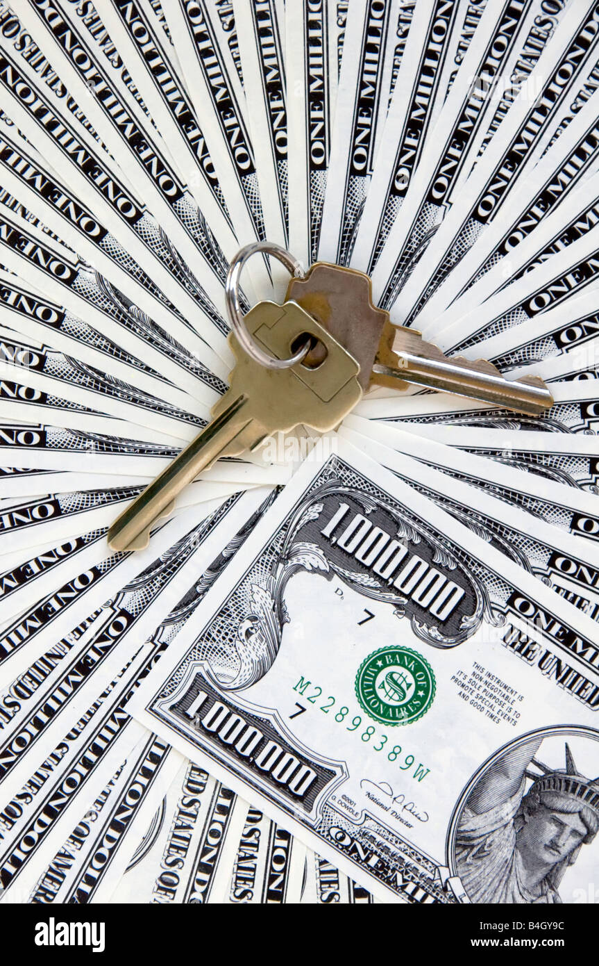 Two keys on millions in cash Stock Photo - Alamy