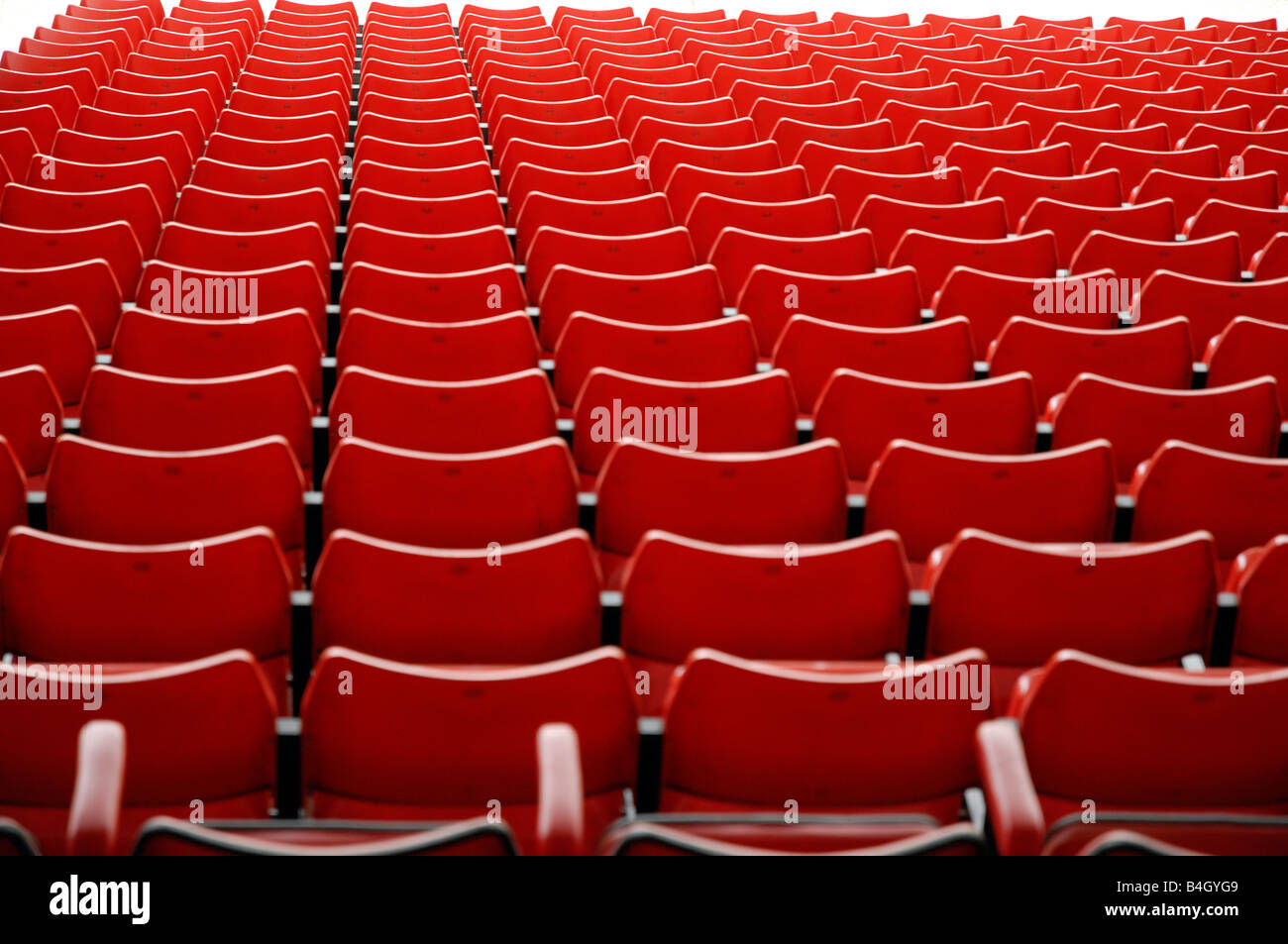 Red seating pattern at football stadium Stock Photo - Alamy