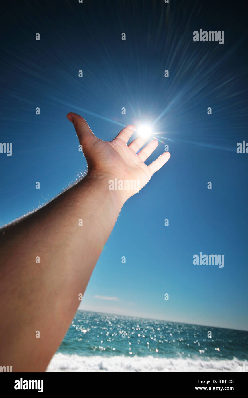 hand reaching the sun Stock Photo - Alamy