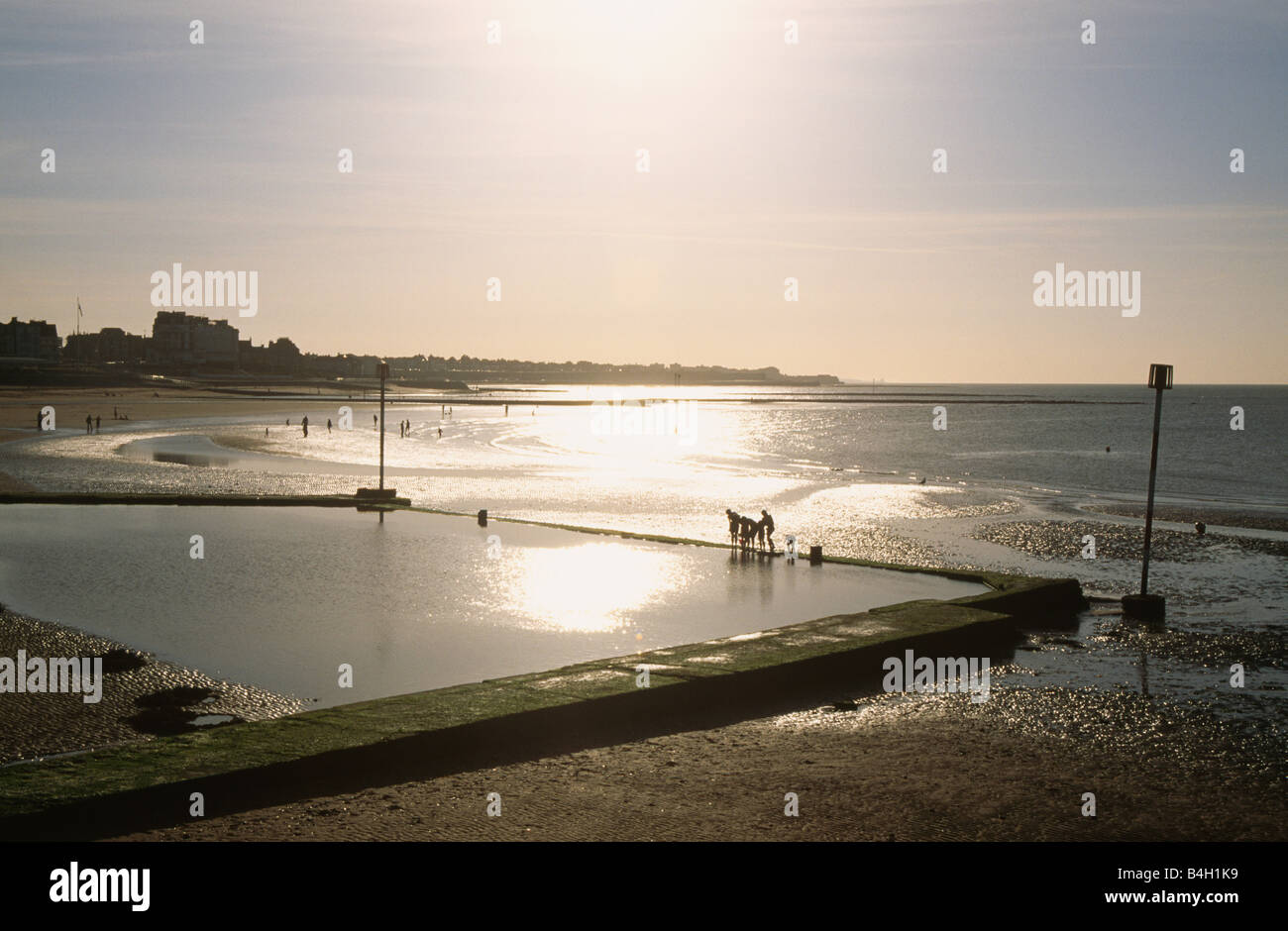 Grey sea and sky with shafts of sunlight at the Lido in Margate in Kent ...