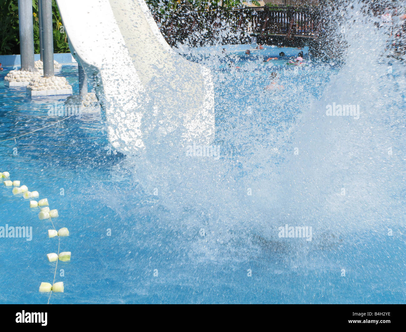splash at end of water slide Stock Photo - Alamy
