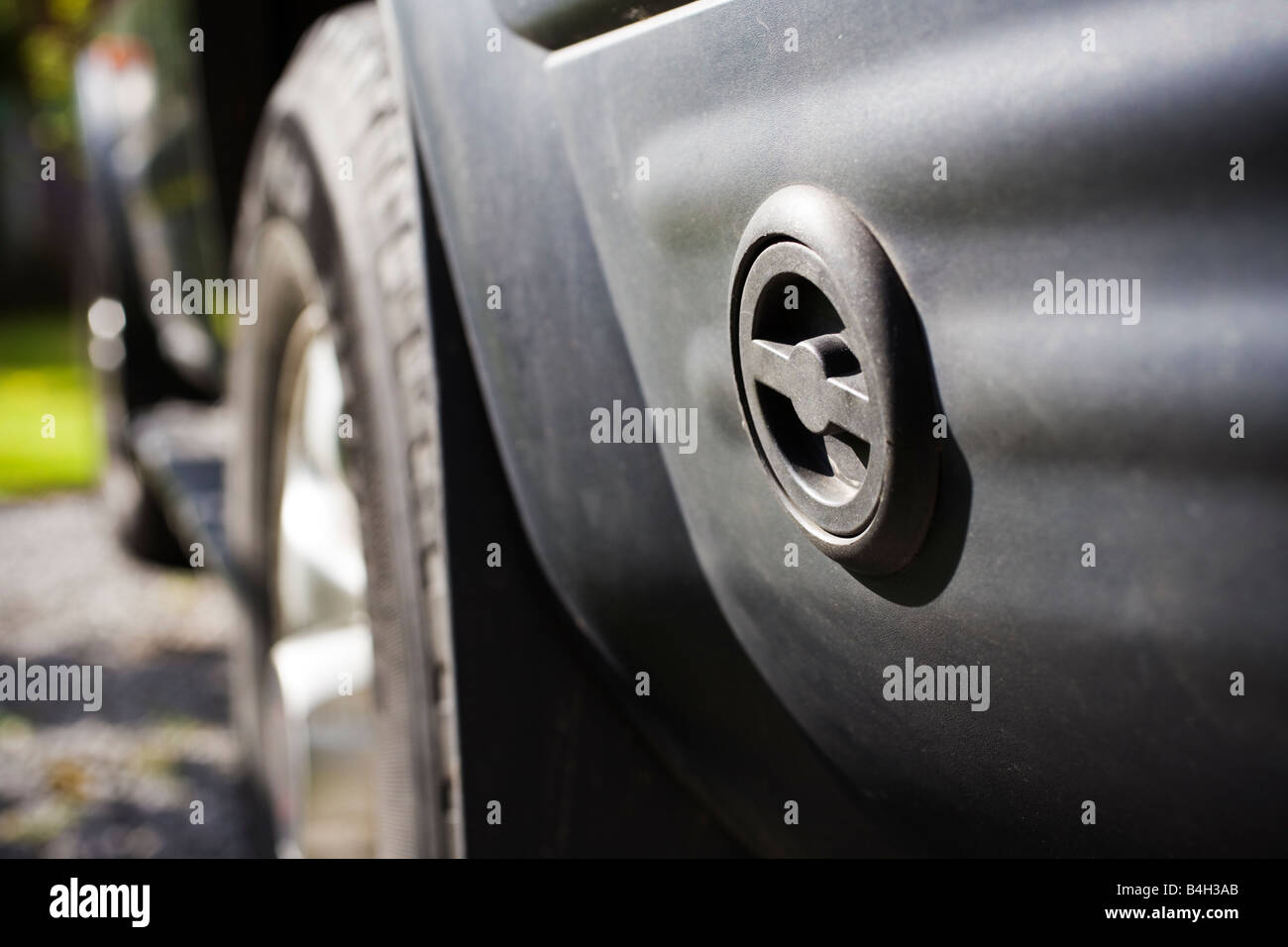 Rear bumper of a 4x4 vehicle showing LPG fuel filling cap, UK ...