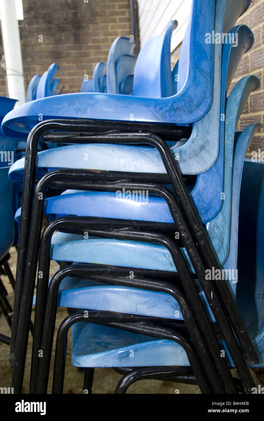 stack of blue plastic chairs Stock Photo - Alamy
