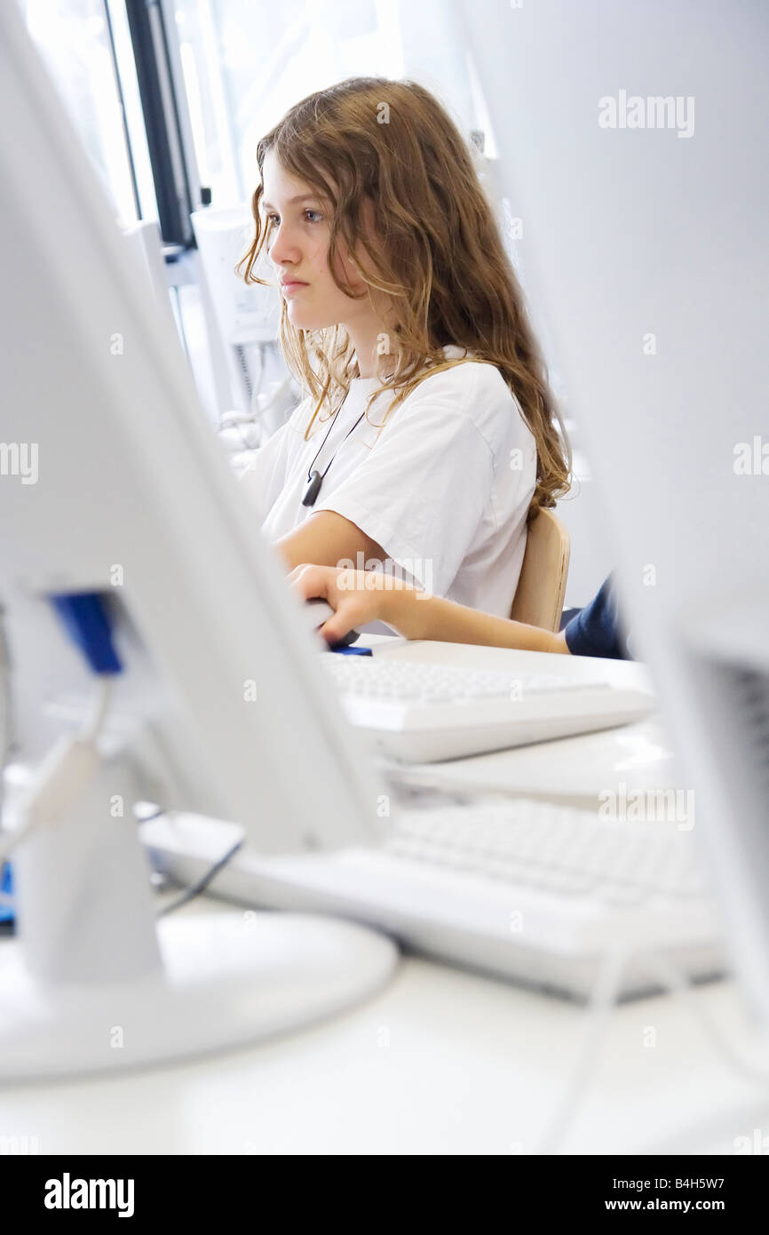 Side profile of girl working on laptop Stock Photo - Alamy