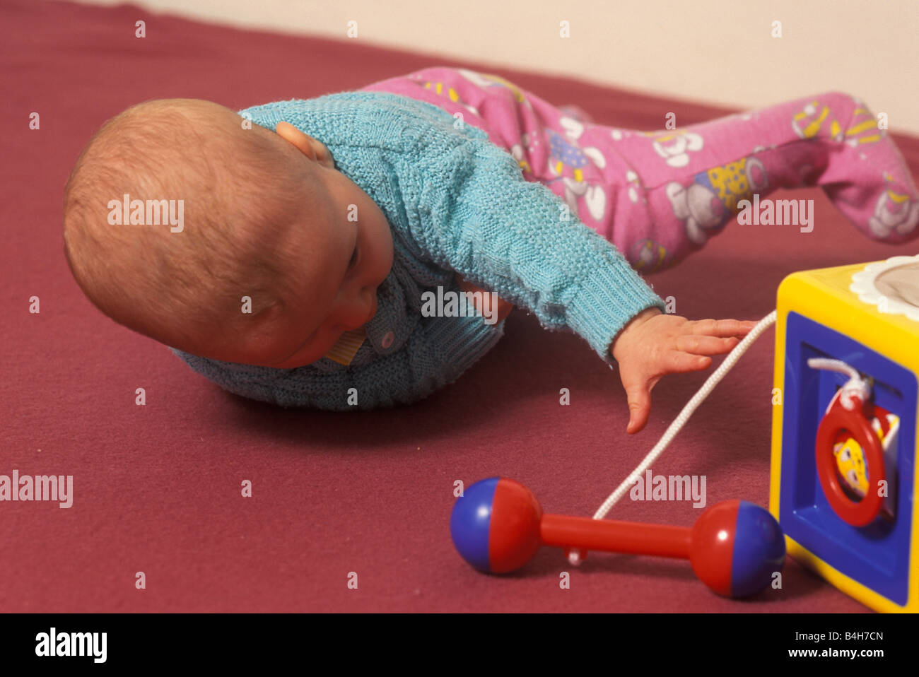 baby rolling over Stock Photo - Alamy