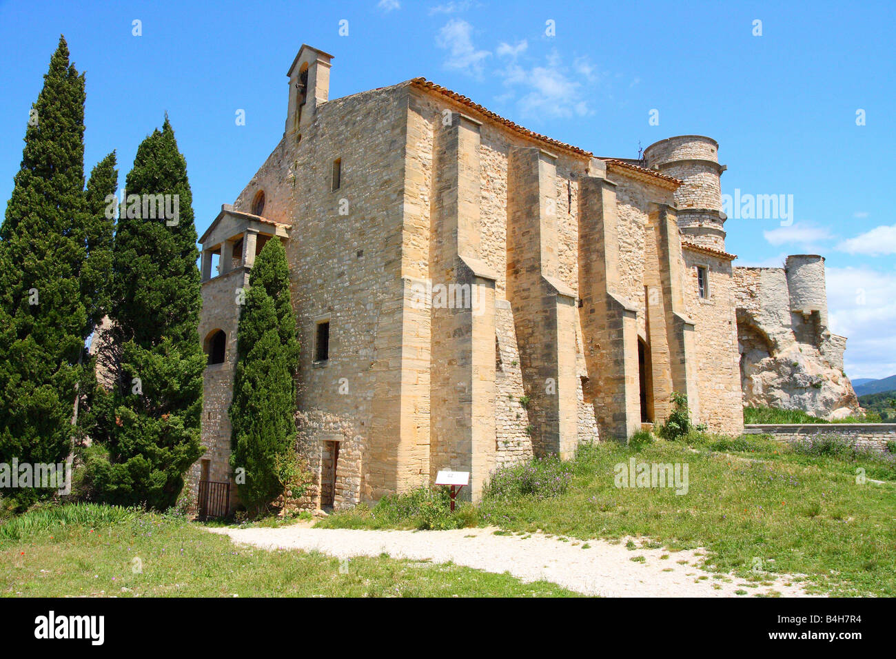 Cypress trees in front of church, Chapelle notre Dame La Brune ...