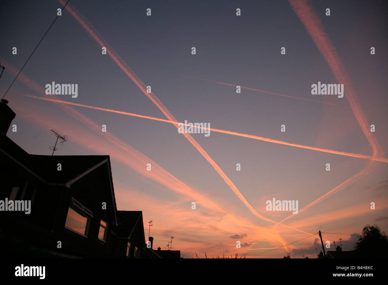 Heathrow flight path vapour trails over Berkshire, UK Stock Photo - Alamy