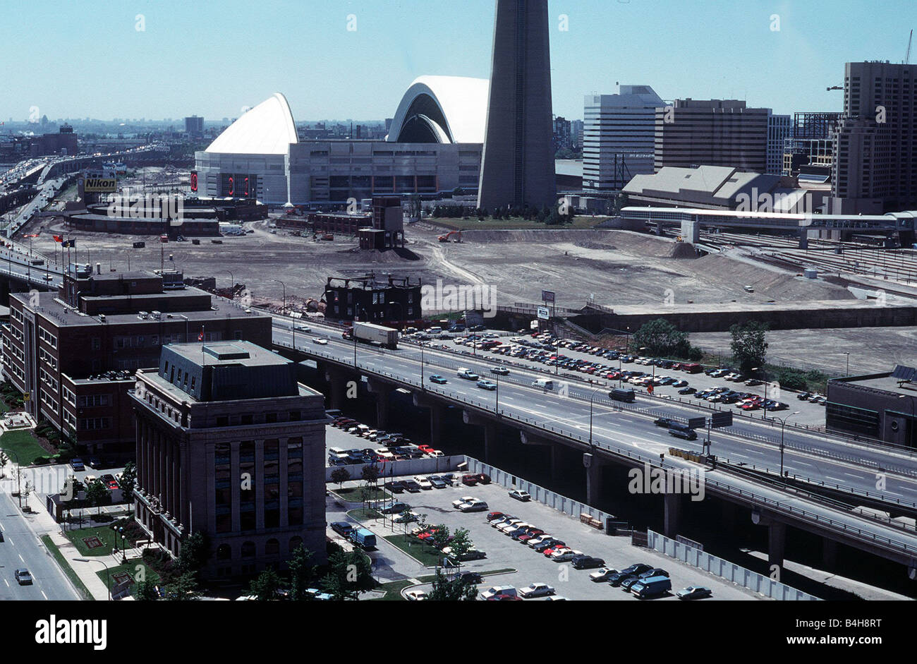 Toronto Ontario Skydome with roof opened and base of CNN Tower Stock ...