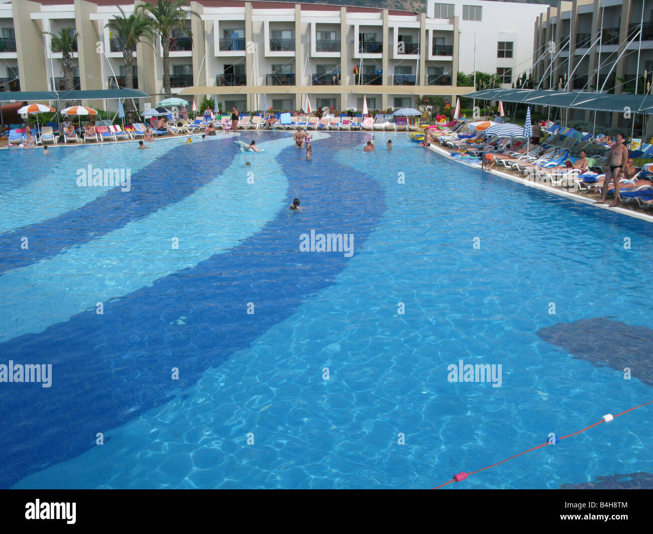 Swimming pool at holiday resort Stock Photo - Alamy