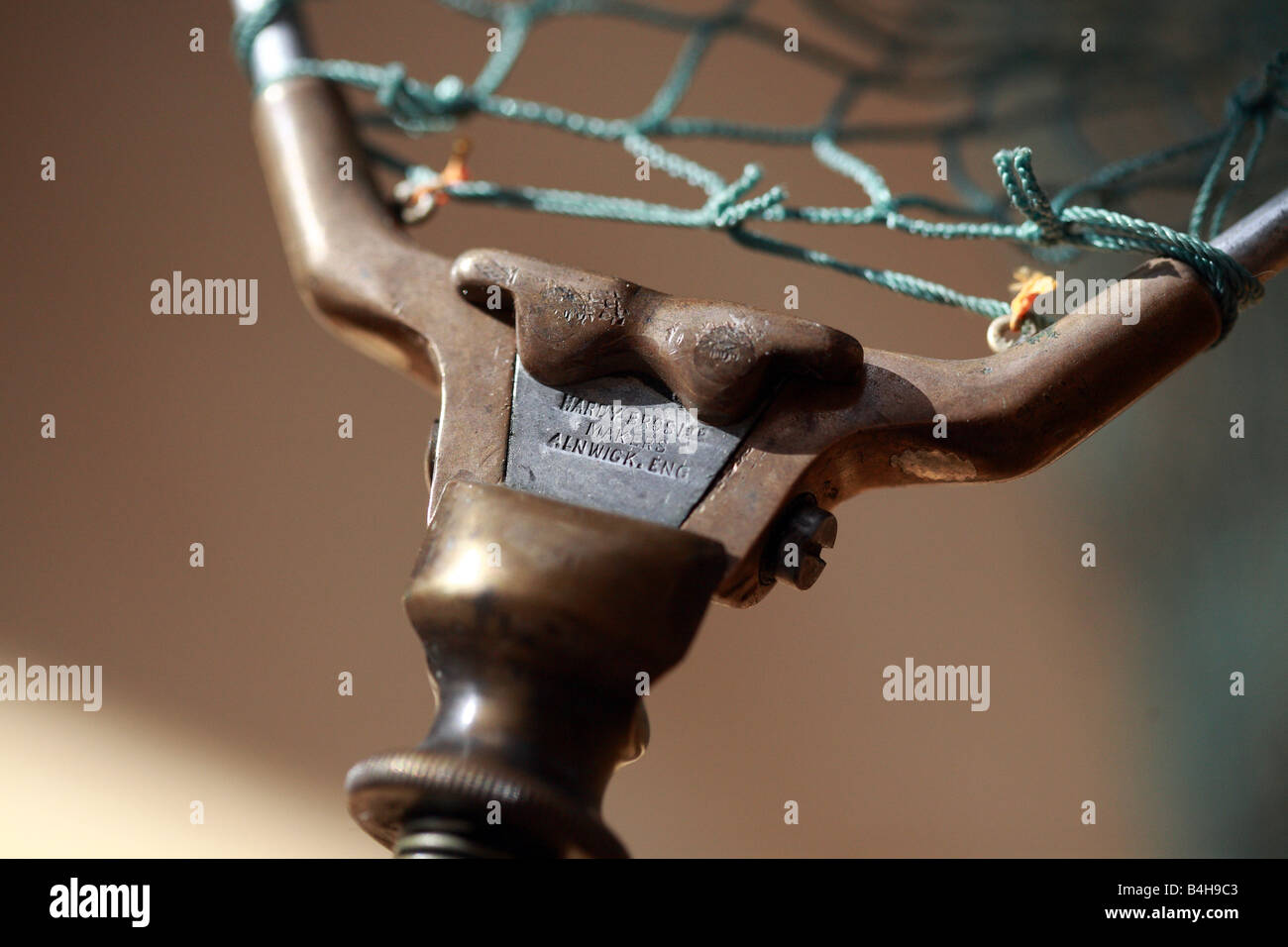 Mesh fishing vintage brass hi-res stock photography and images - Alamy