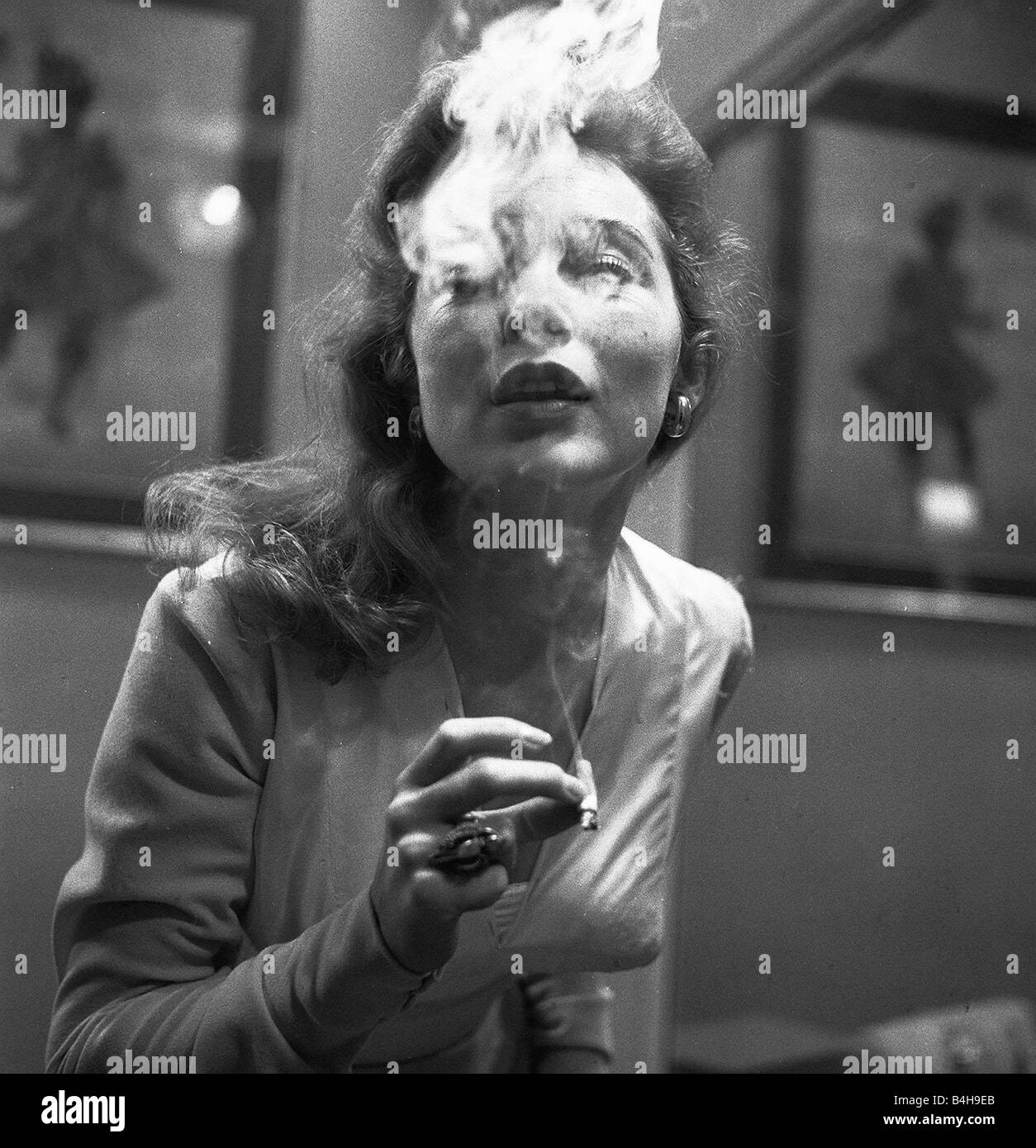 Actress Janet Leigh gets her nicotine fix at a costume fitting for the ...