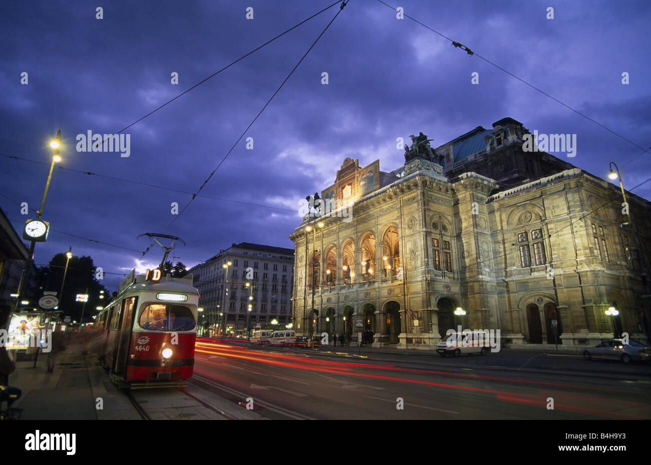 Cable car moving on tramway at dusk Vienna State Opera Vienna Austria ...