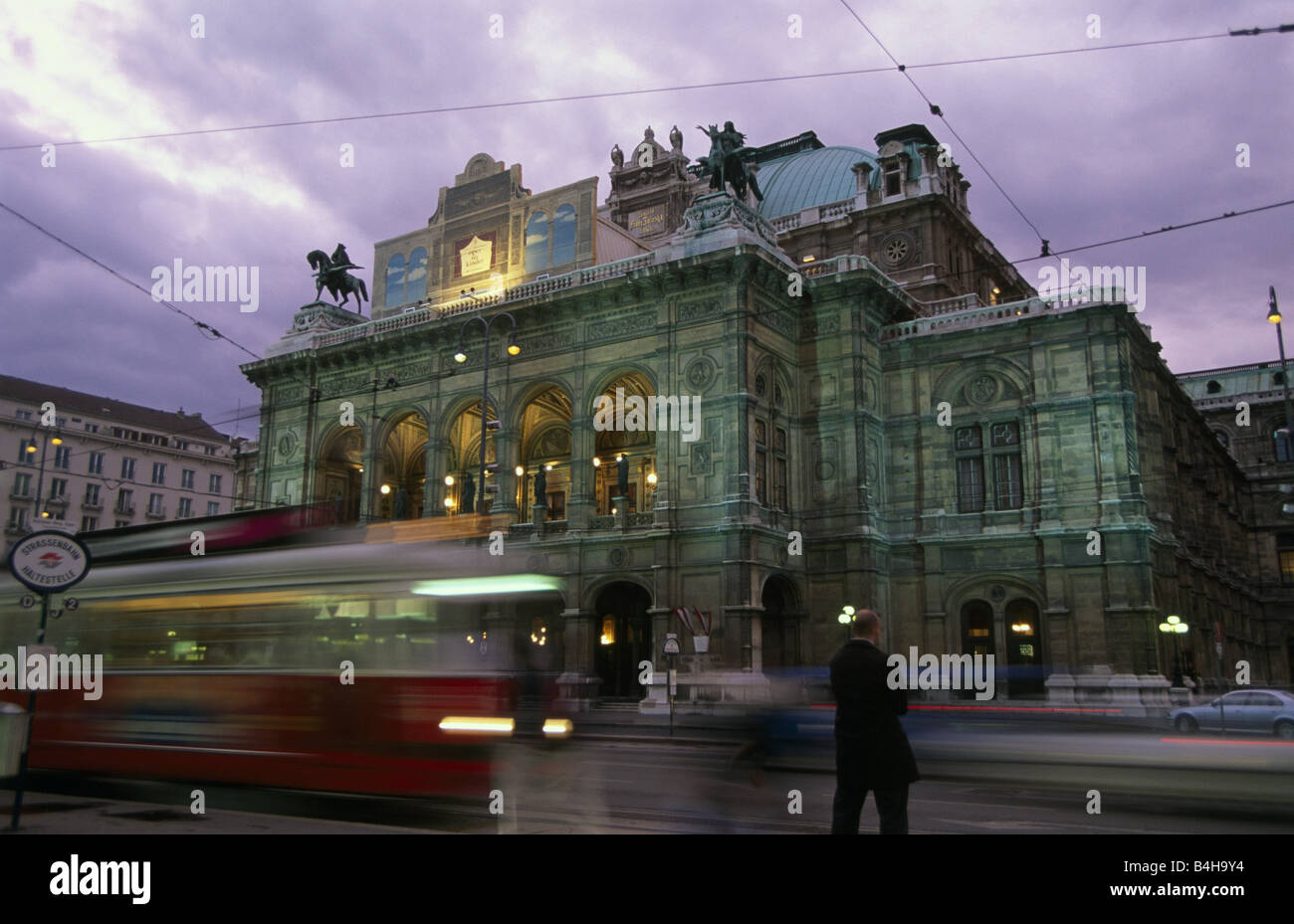 Cable car moving on tramway at dusk Vienna State Opera Vienna Austria ...